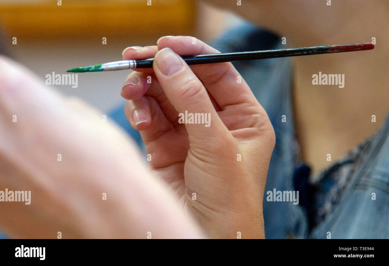 Drawing lesson at school.Children's hands holding a brush Stock Photo ...