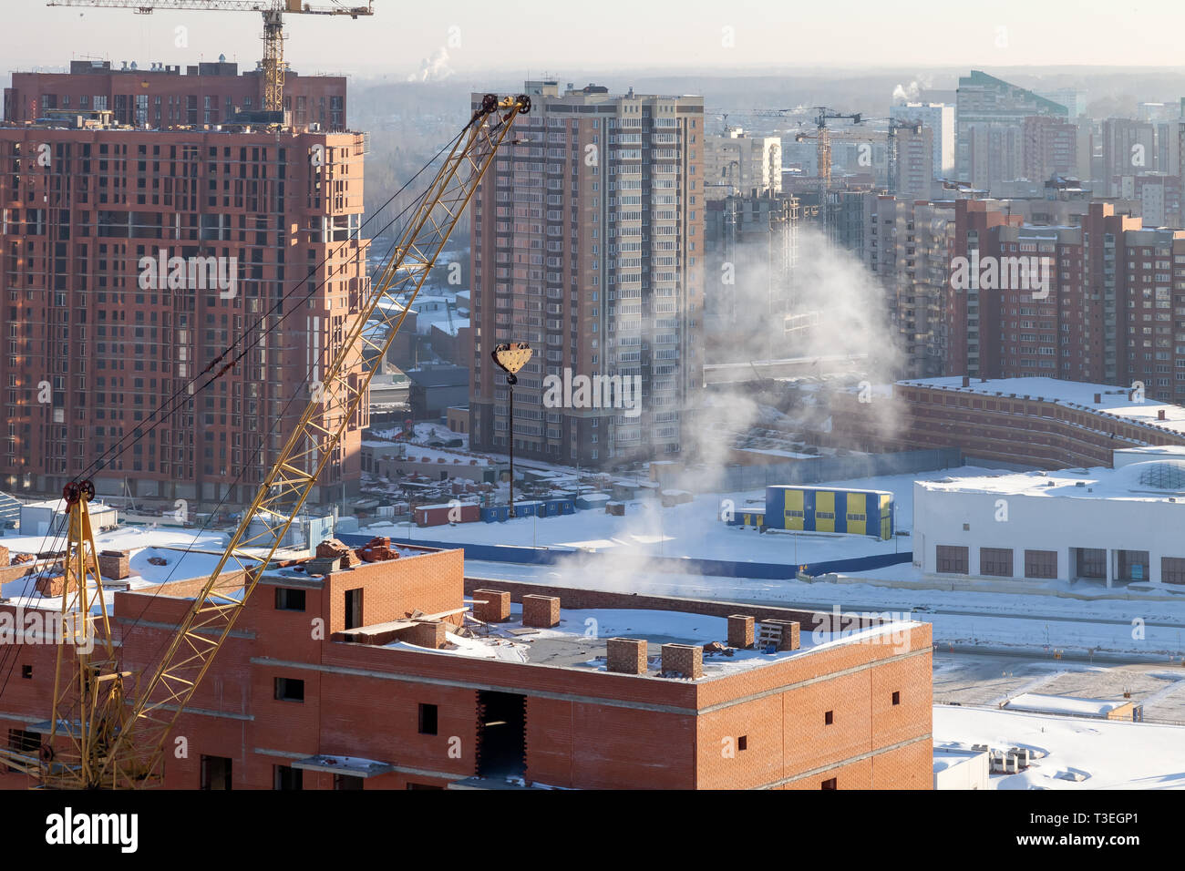 Aerial view of a new modern house under construction with a yellow ...