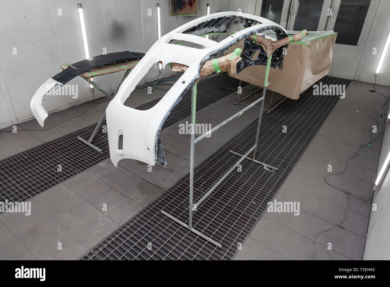 Painting and drying in a professional box of car body parts after ...