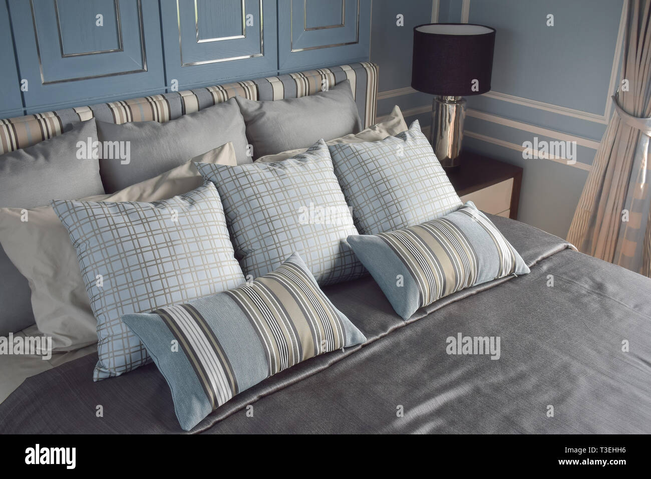 Light blue pillows in difference pattern with classic style bedding ...