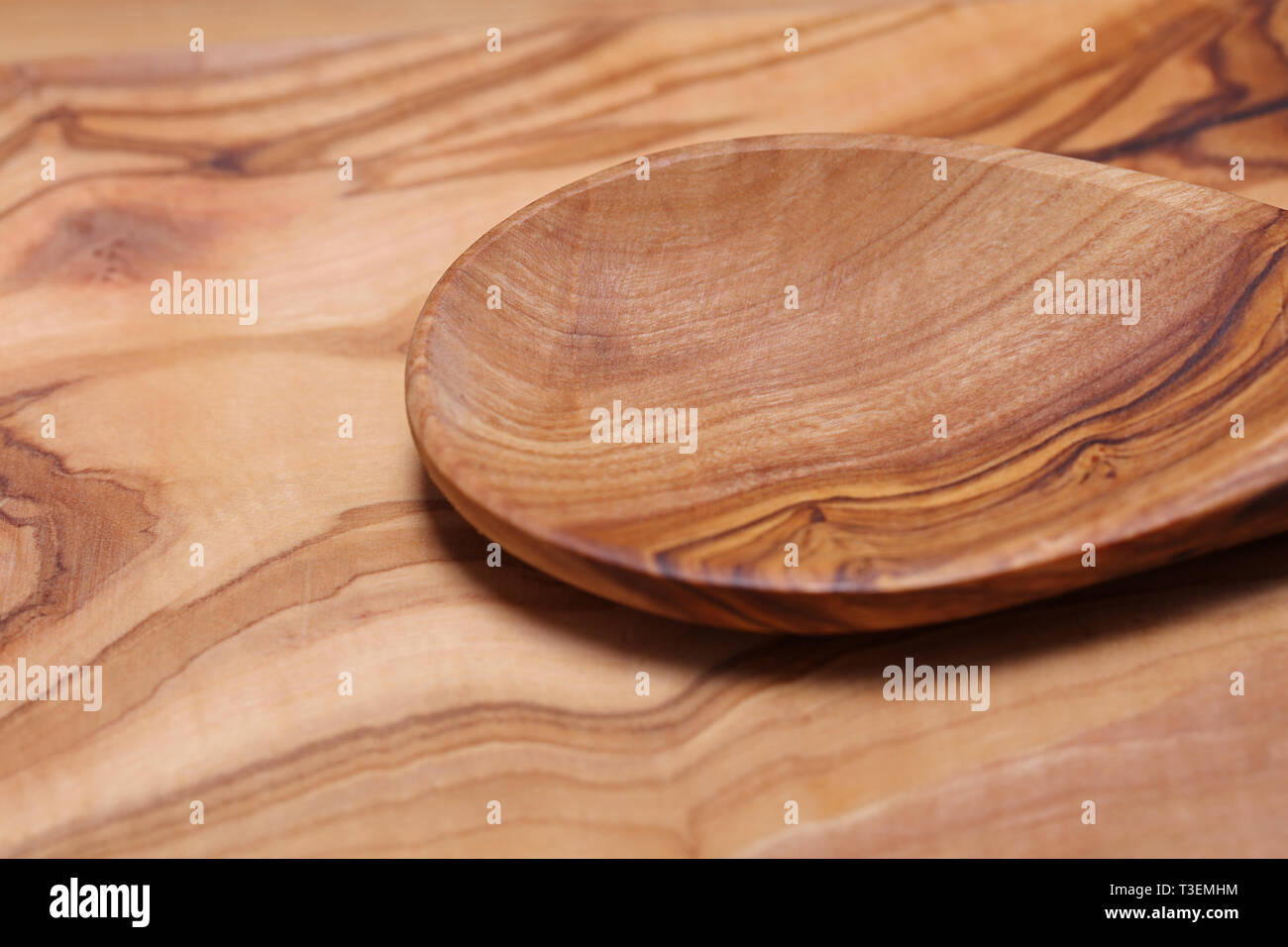 Wooden spoon on wooden background Stock Photo - Alamy