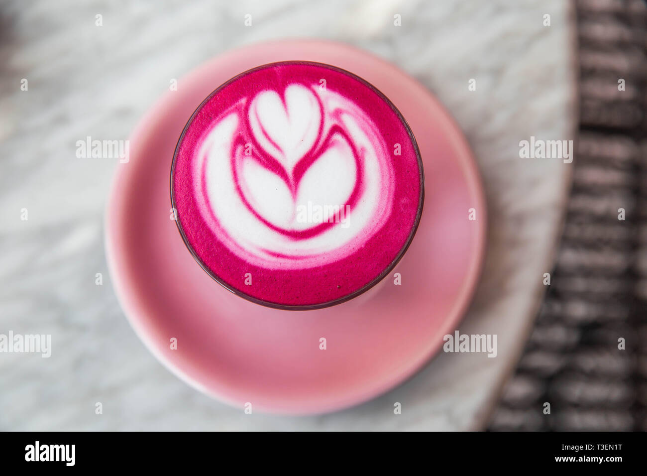 Two Beetroot super latte on marble background. Trandy healthy drink ...