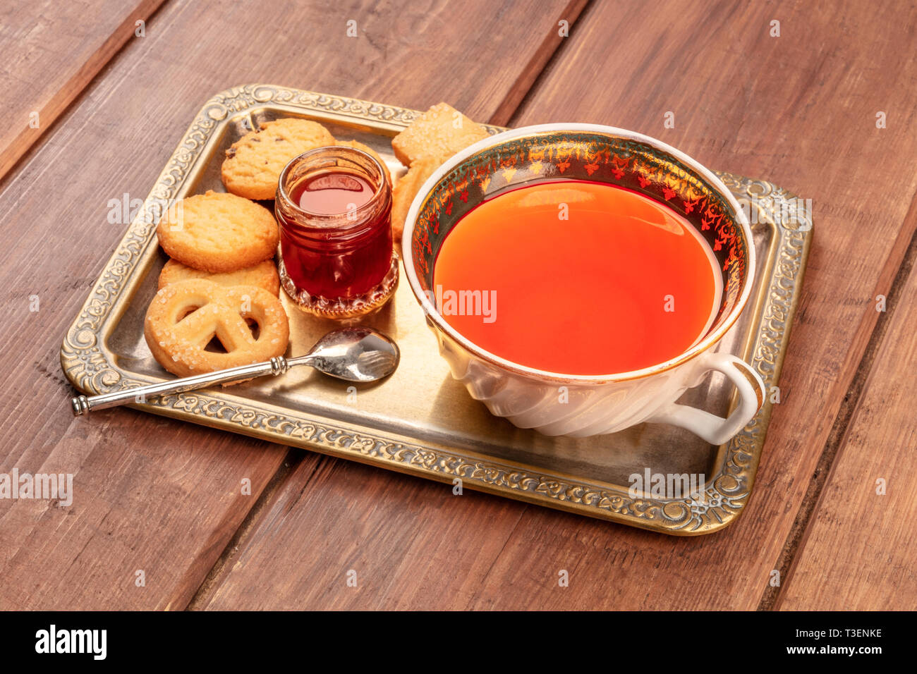 Danish butter cookies on a vintage tray with a cup of tea and jam on a ...