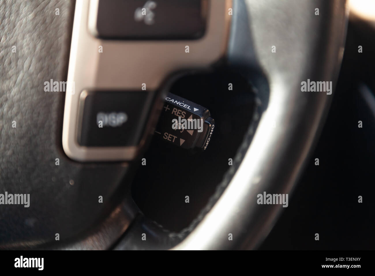 The shift lever to set the automatic cruise control speed inside the ...