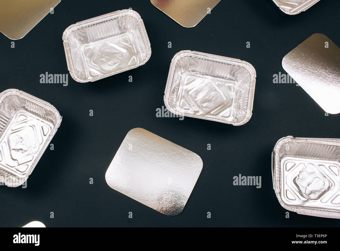 Plastic pollution. Aluminum foil containers for food and silver ...