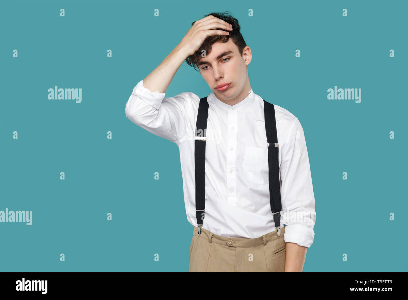 Sad loser man holding his head and confused. Portrait of handsome ...