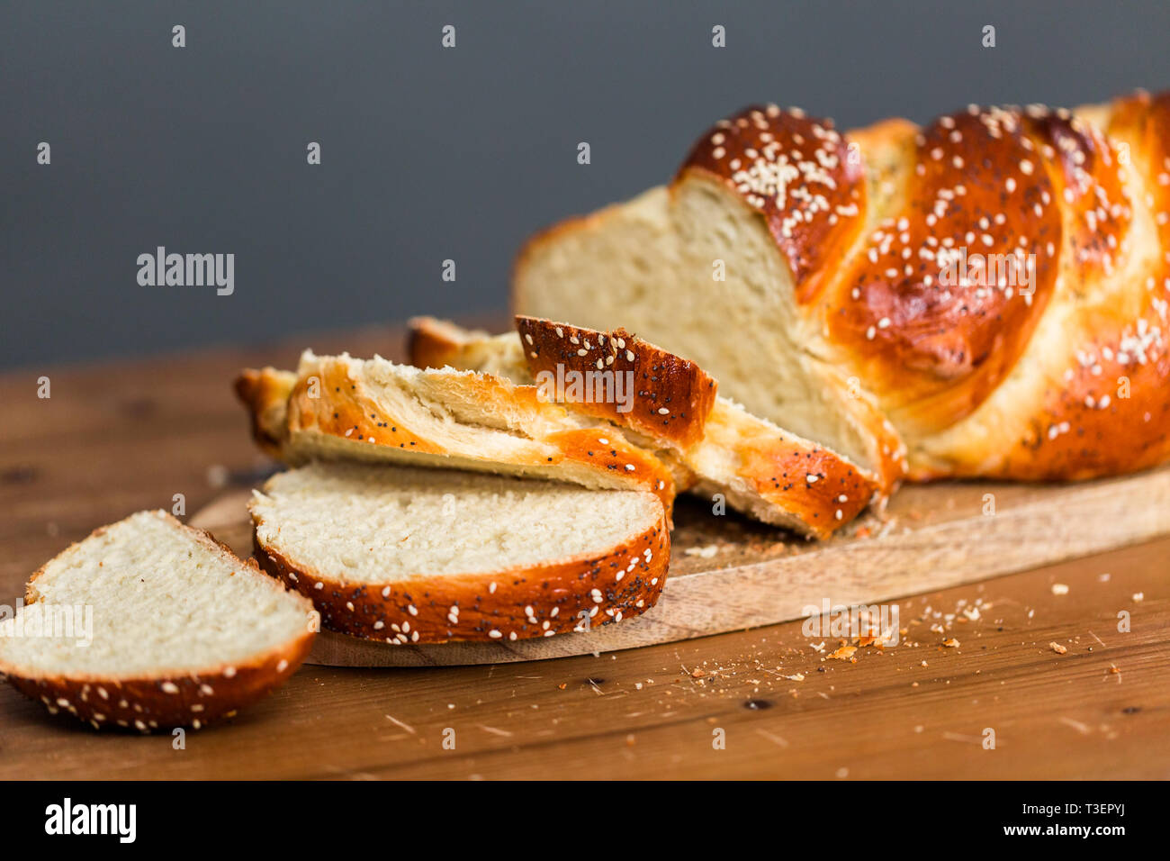 Sliced fresh challah bread on the wood table Stock Photo - Alamy