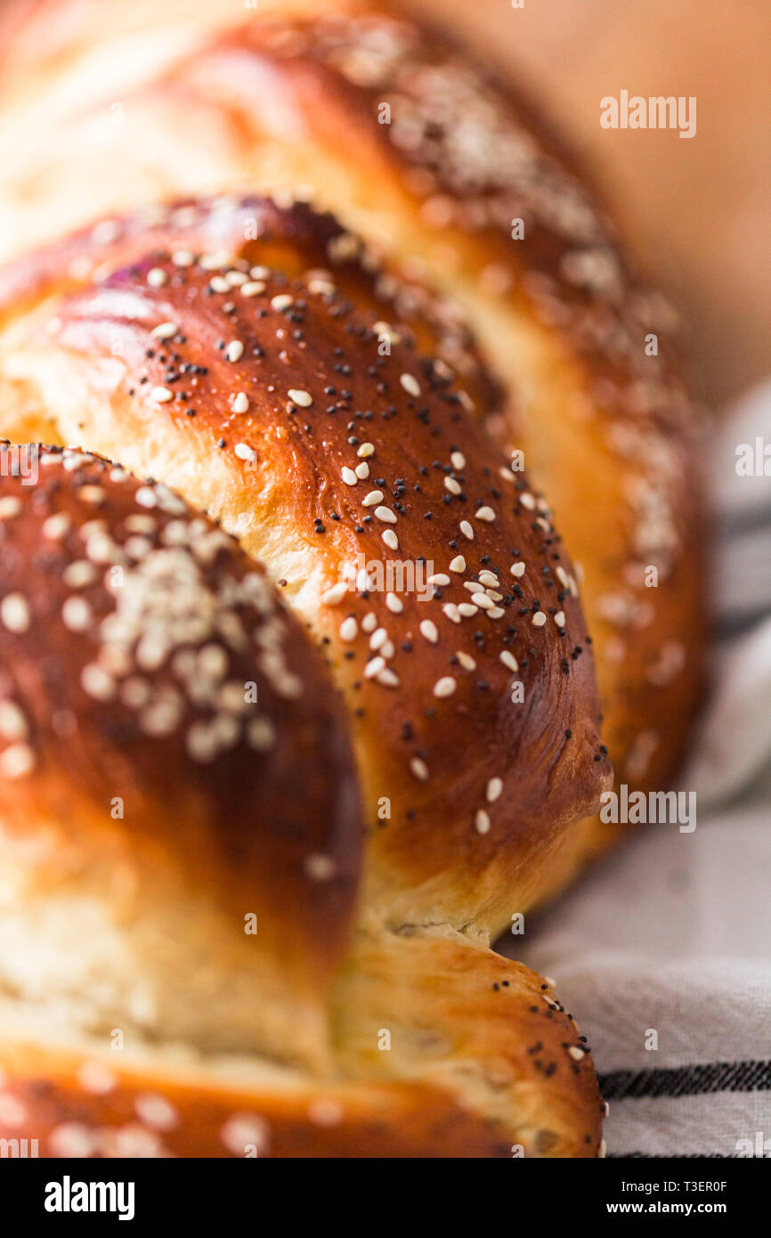 Close up of braided challah bread with sesame and poppy seeds Stock ...