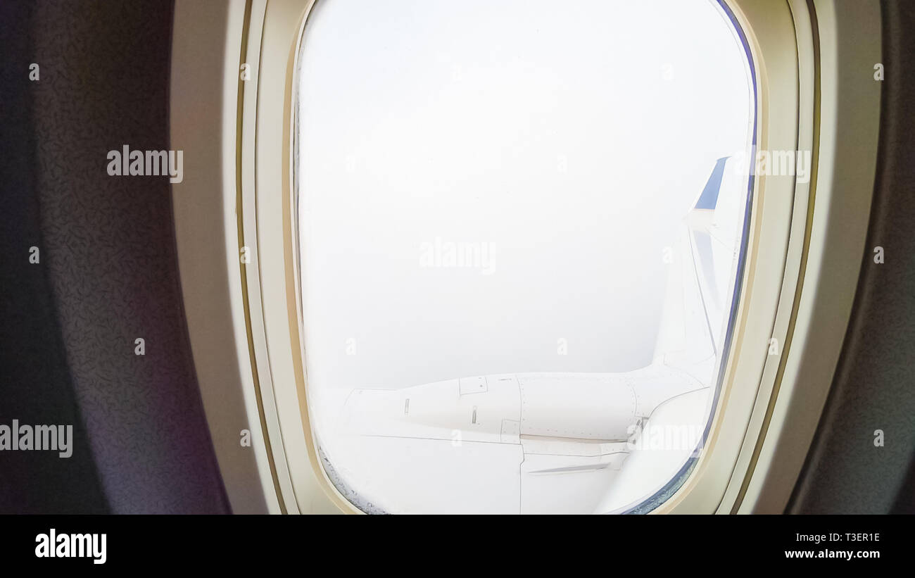 View from the window seat of commercial passenger airplane Stock Photo ...