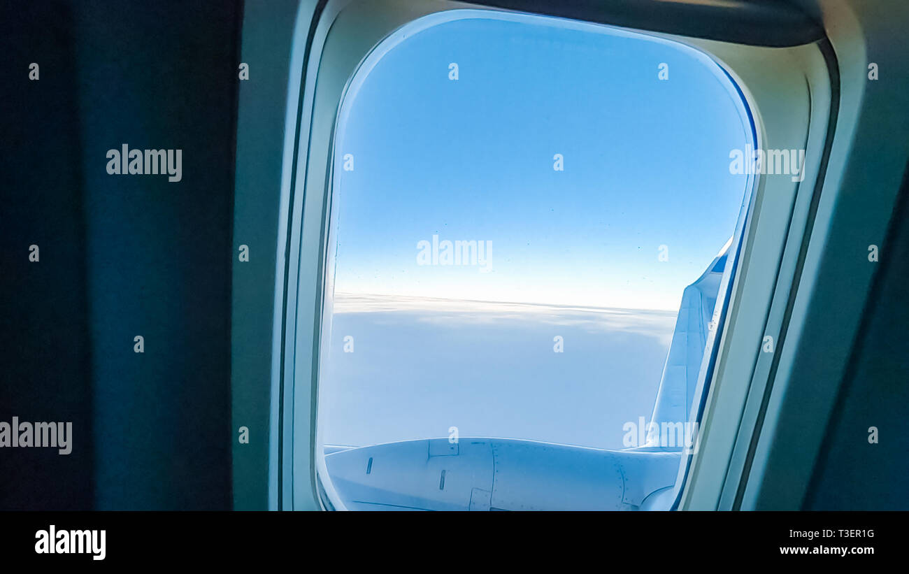 View from the window seat of commercial passenger airplane Stock Photo ...