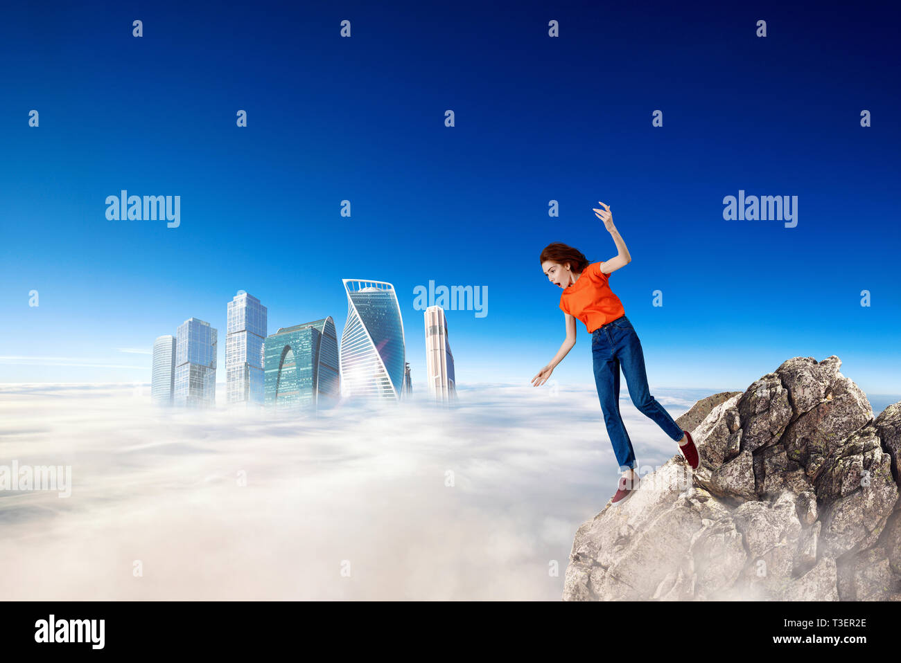 Young woman stumbled on the rocks and going to falls down Stock Photo ...