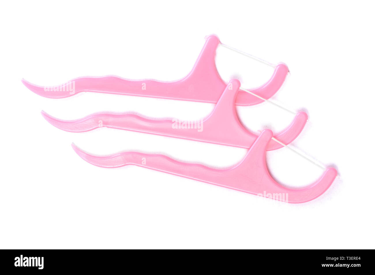 Pink floss toothpick isolated on white background Stock Photo - Alamy