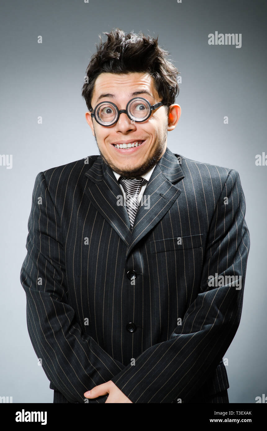 Funny nerd businessman in dark studio Stock Photo - Alamy