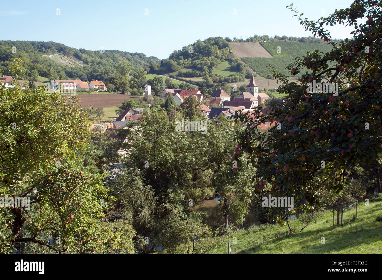 Bavaria Germany, rural village with plowed fields and apple orchards ...