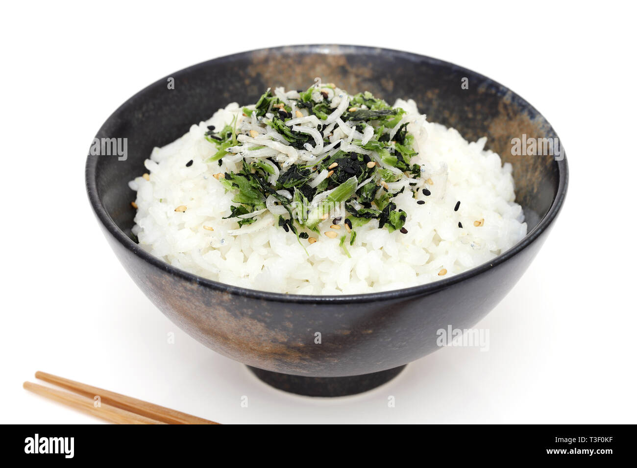Japanese Shirasu and takana vegetable on cooked white rice on white ...