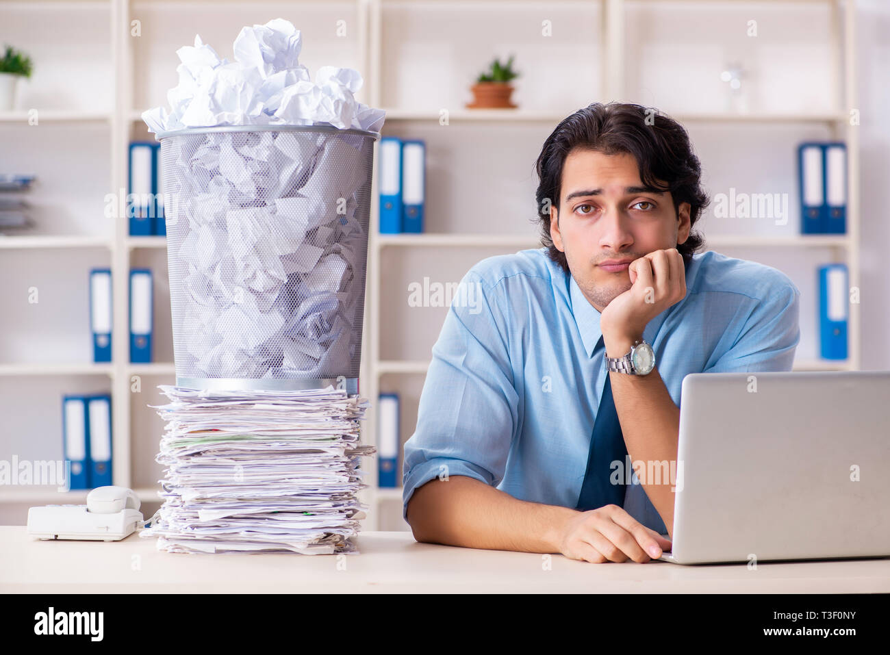 Businessman rejecting new ideas with lots of papers Stock Photo - Alamy