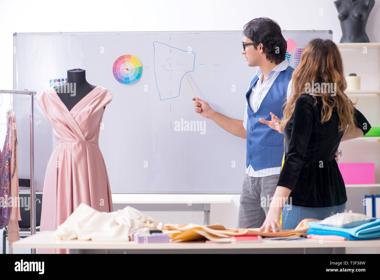 Tailor student cutting fabric hi-res stock photography and images - Alamy