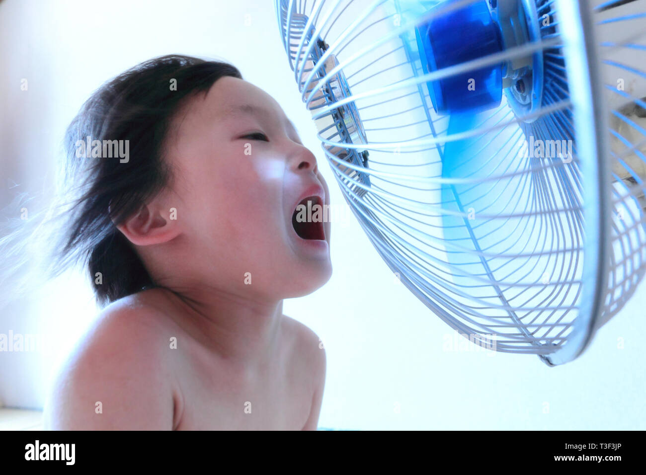 Fan and children Stock Photo - Alamy