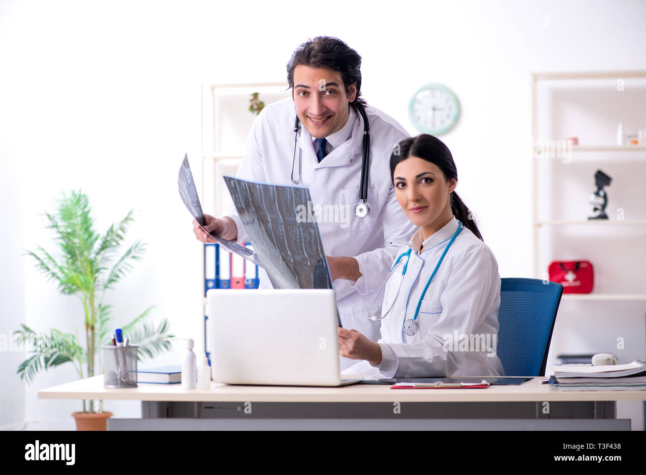 Two young doctors working in the clinic Stock Photo - Alamy