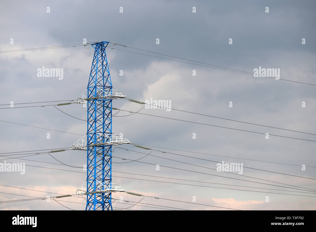 High voltage power line post with electrical wires and capacitors on ...