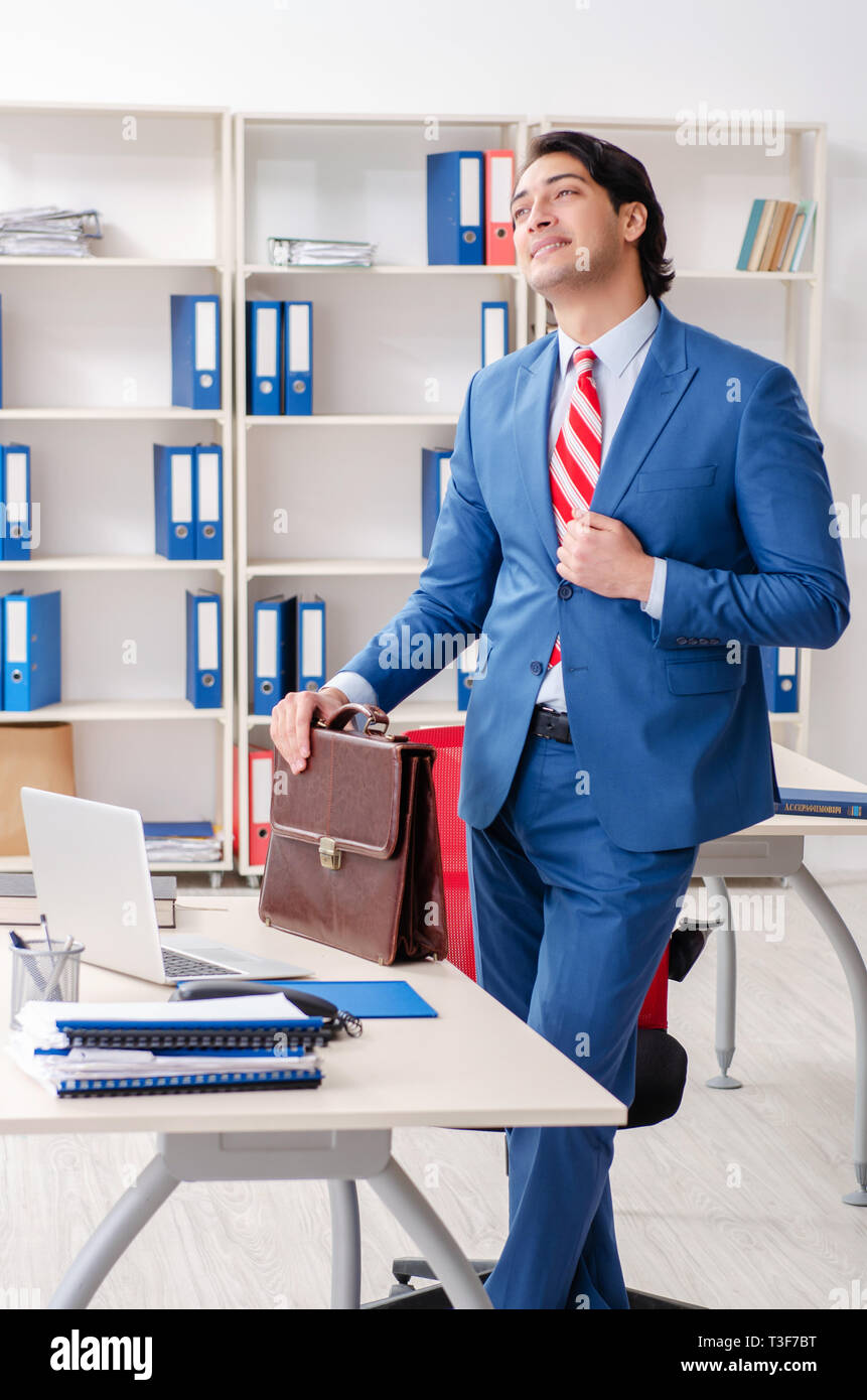 Young happy male employee in the office Stock Photo - Alamy