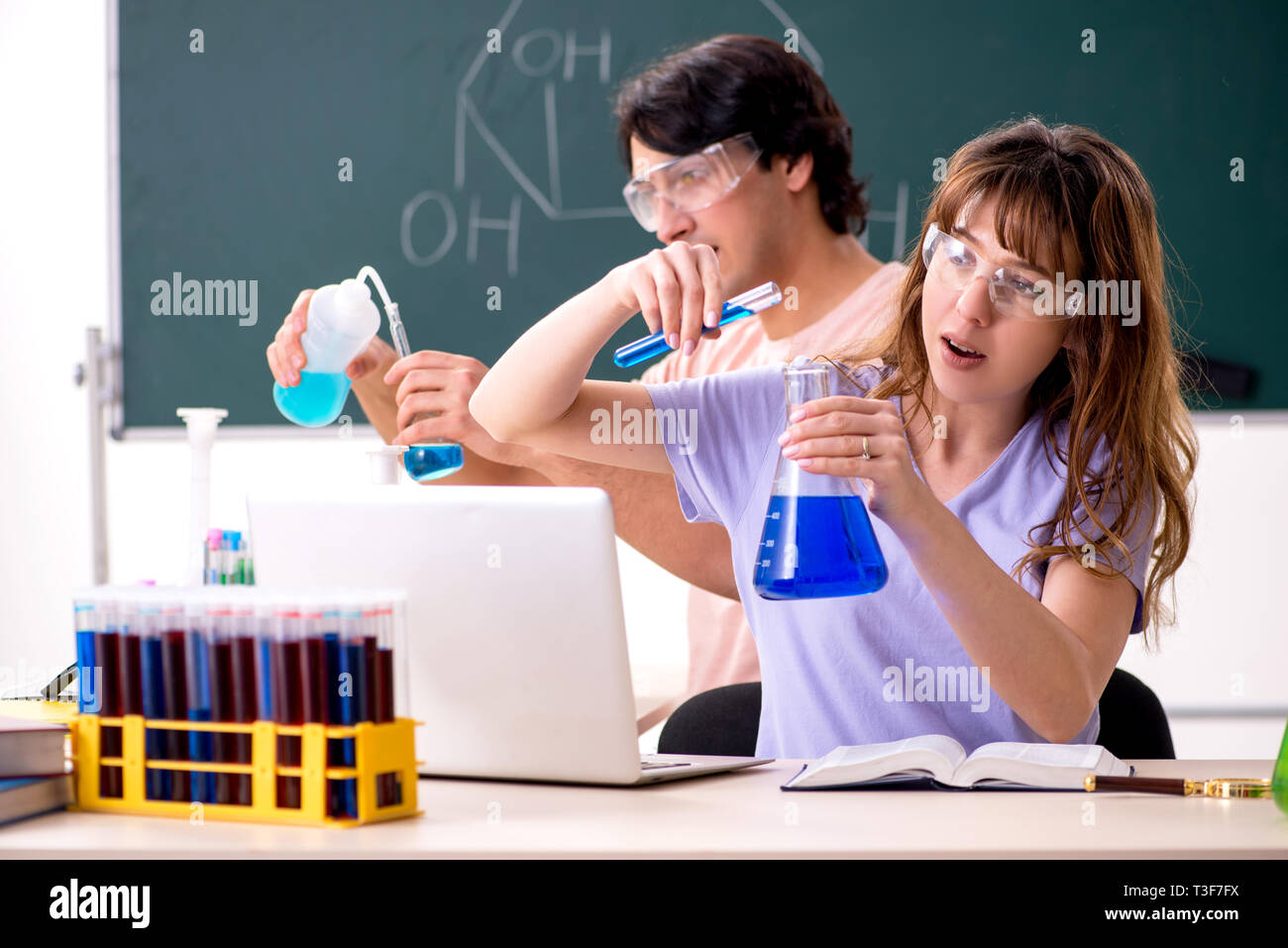 Two chemists students in classroom Stock Photo - Alamy