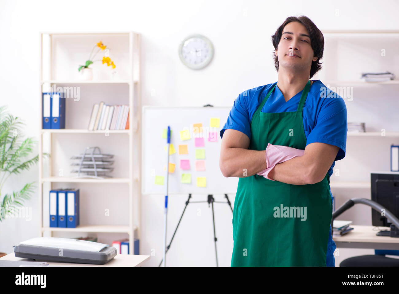 Male handsome professional cleaner working in the office Stock Photo ...