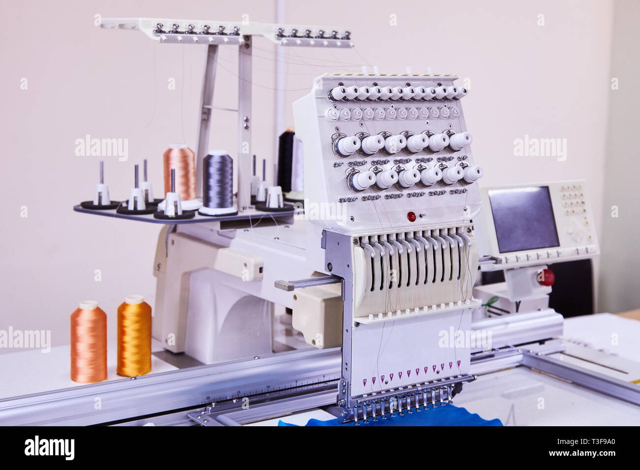 12 Needle Compact Embroidery Machine. Industrial Embroidery Stock Photo ...