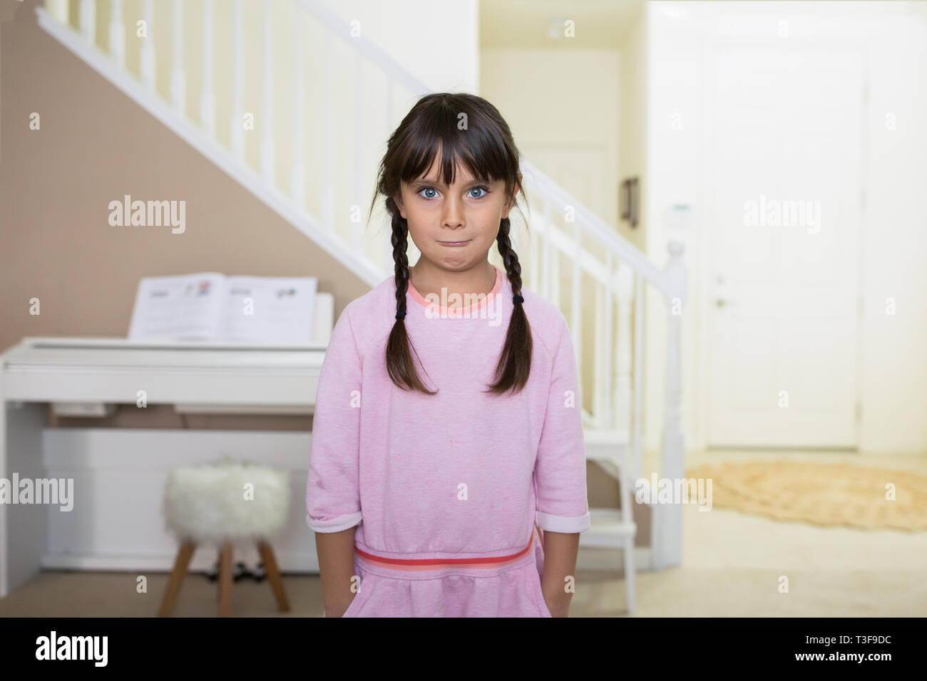 6-7 year old beautiful girl has a blank facial expression Stock Photo ...