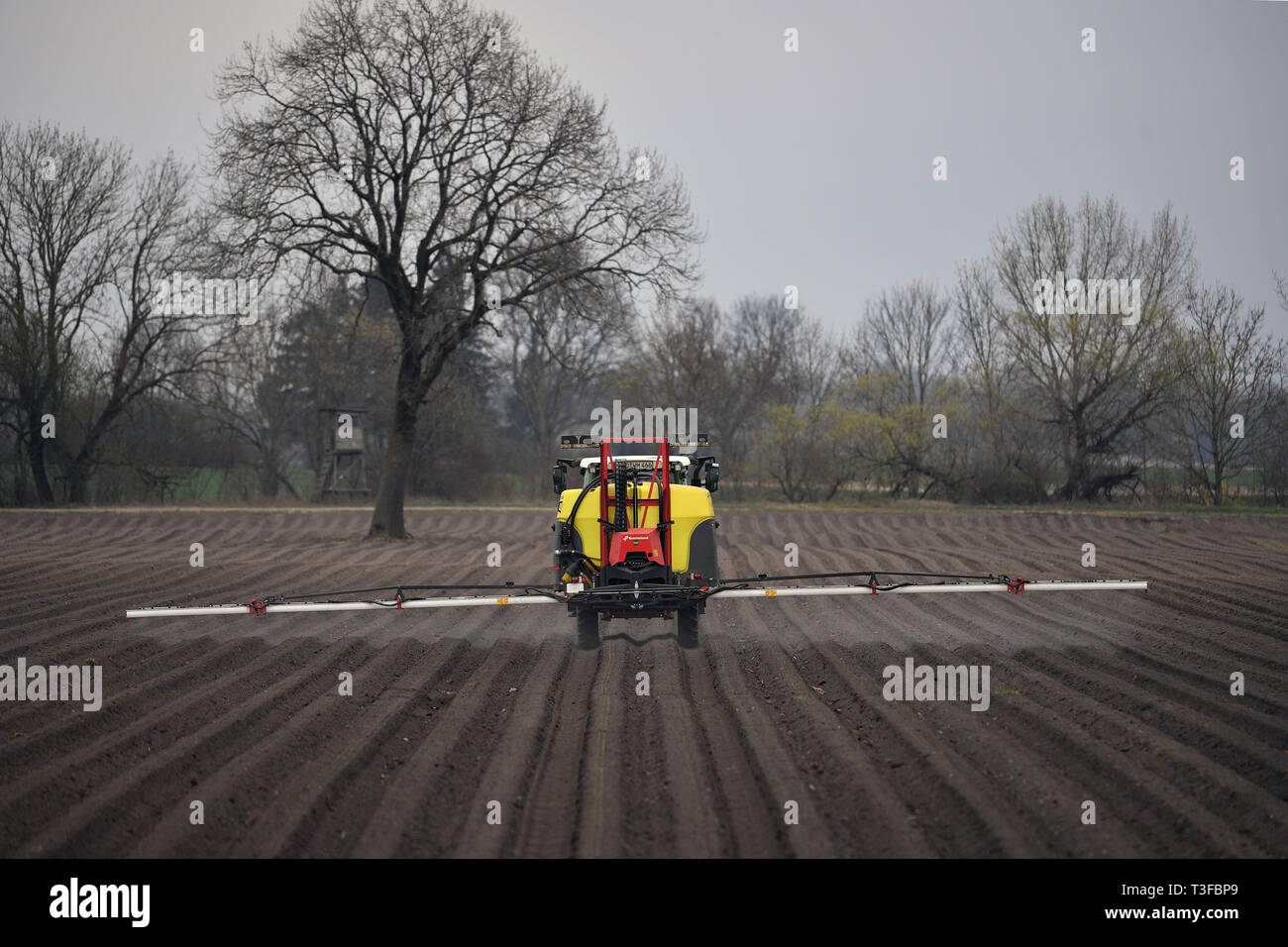 Munich, Deutschland. 08th Apr, 2019. A farmer brings out crop ...