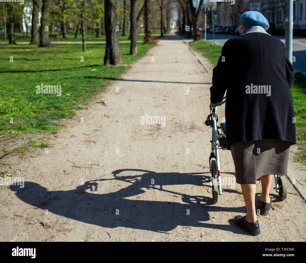 Neuruppin, Germany. 07th Apr, 2019. An elderly woman with a rollator ...