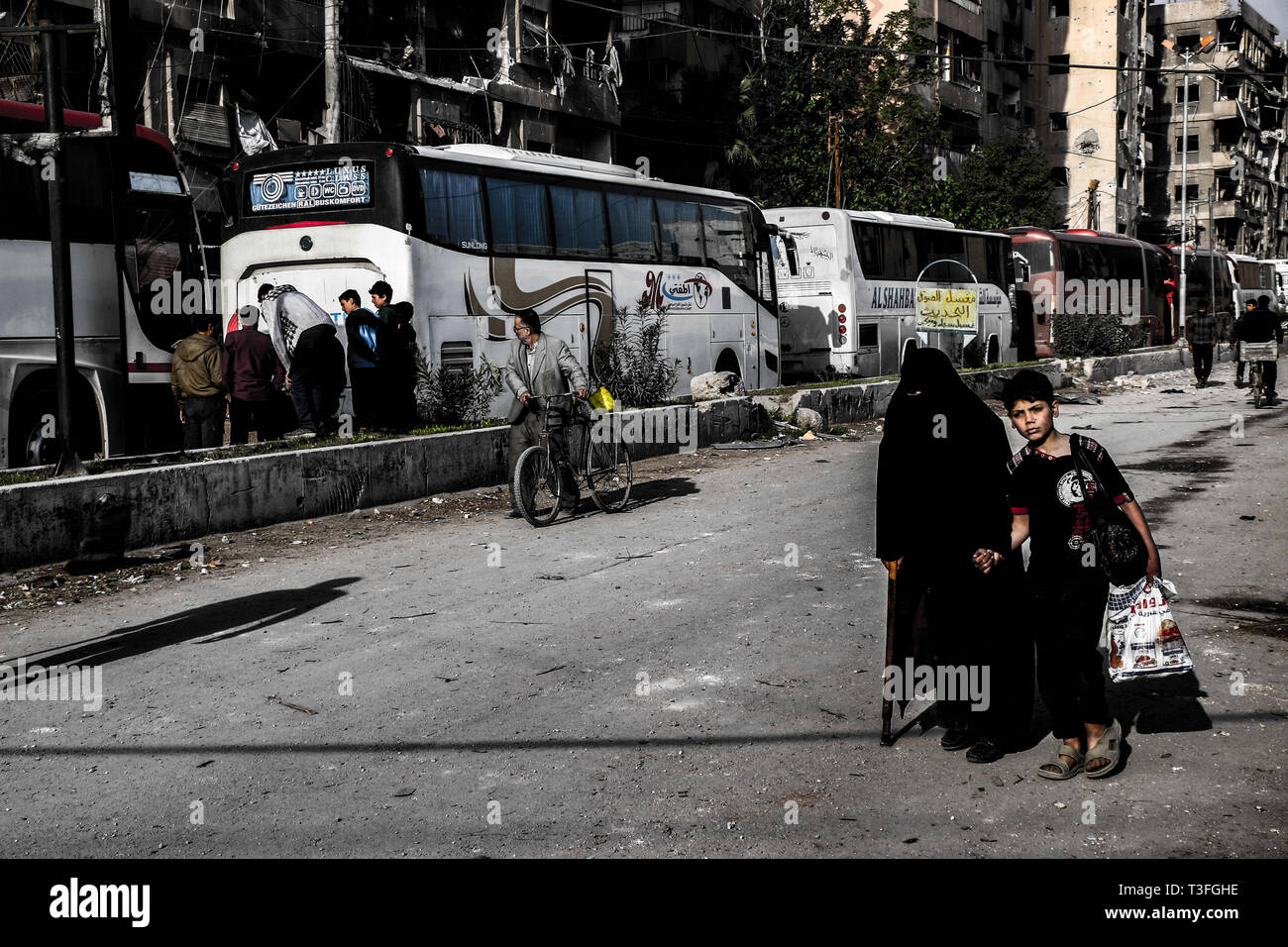Douma, East of Damascus, Syria. 9th Apr, 2018. Civilians seen next to ...
