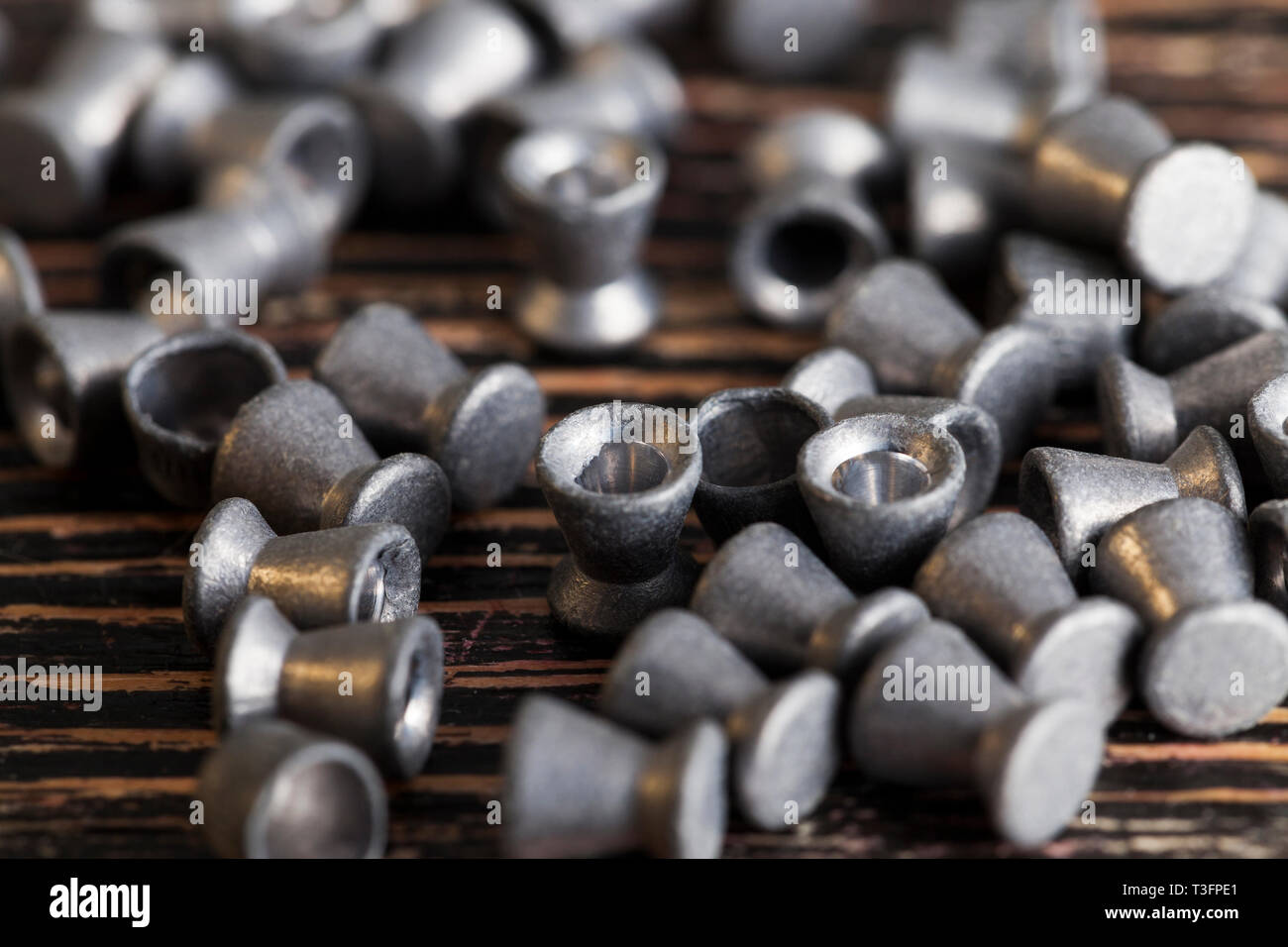 Small bullets for an air rifle, closeup remote on a wooden floor Stock ...