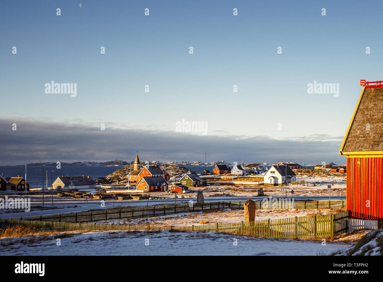 Nuuk city suburb with Inuit houses with sea and the fjord background ...