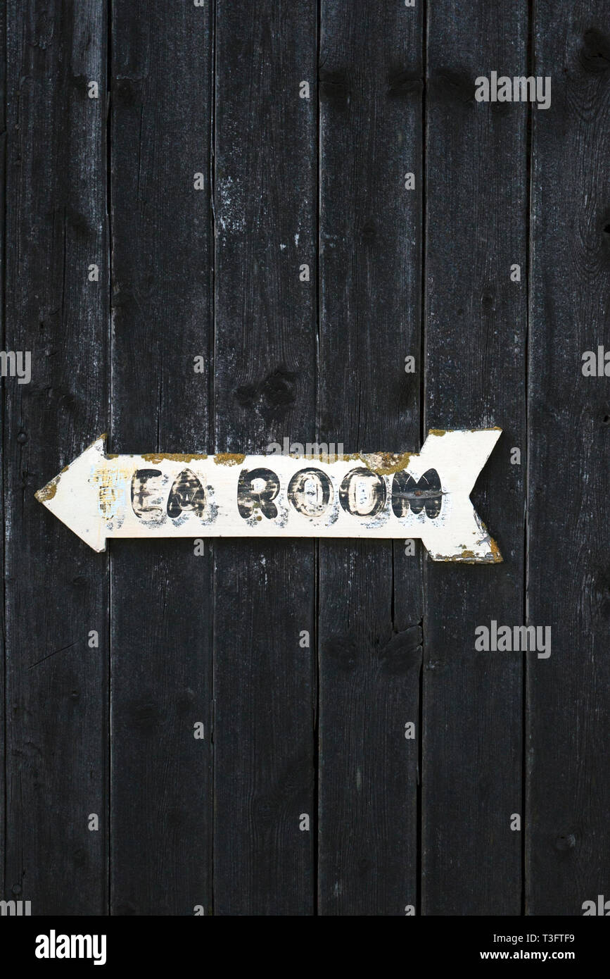 A Weathered Hand Painted Tea Room Sign On A Wooden Arrow Fixed To The ...