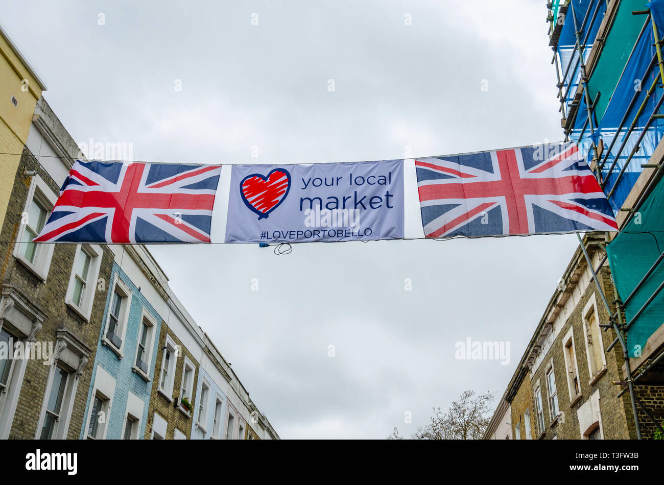 Union jack flags form part of a banner that spans overhead above ...