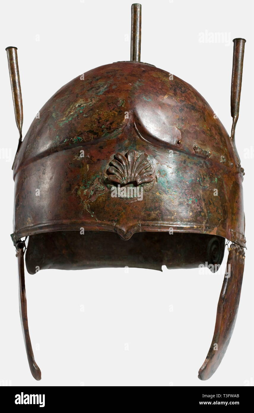 A Chalcidian helmet, 5th - 4th century B.C. Bronze. A low offset ...