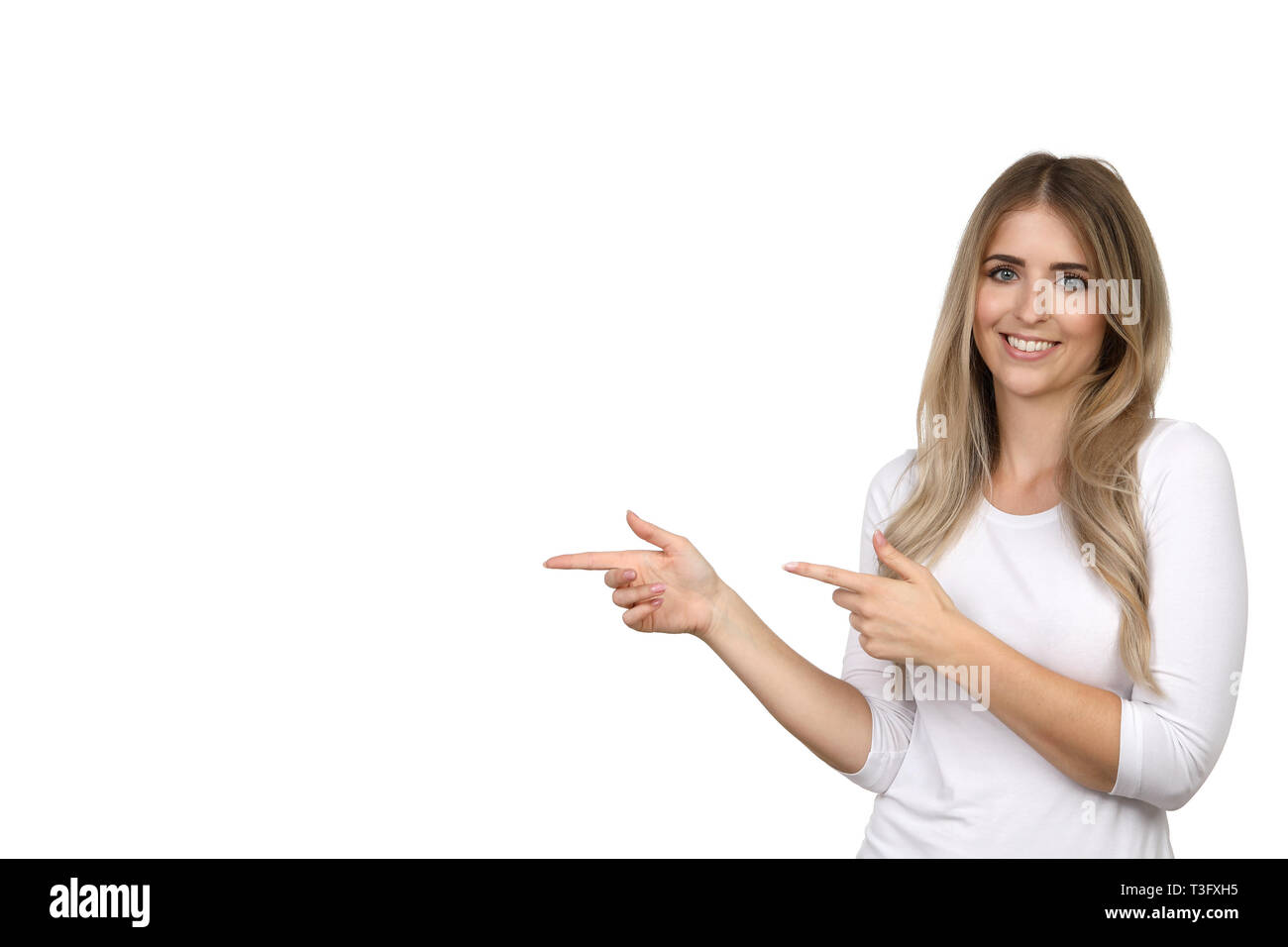 Beautiful blond woman shows something at one side Stock Photo - Alamy