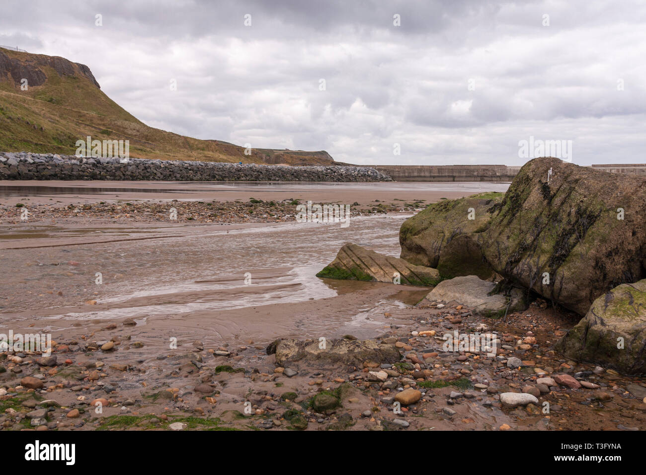 The beach and seafront at Skinningrove,England,UK with the large rocks ...