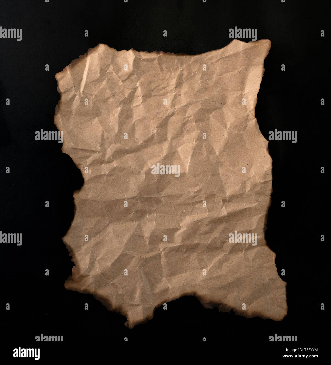 Old crumpled paper burn texture hi-res stock photography and images - Alamy