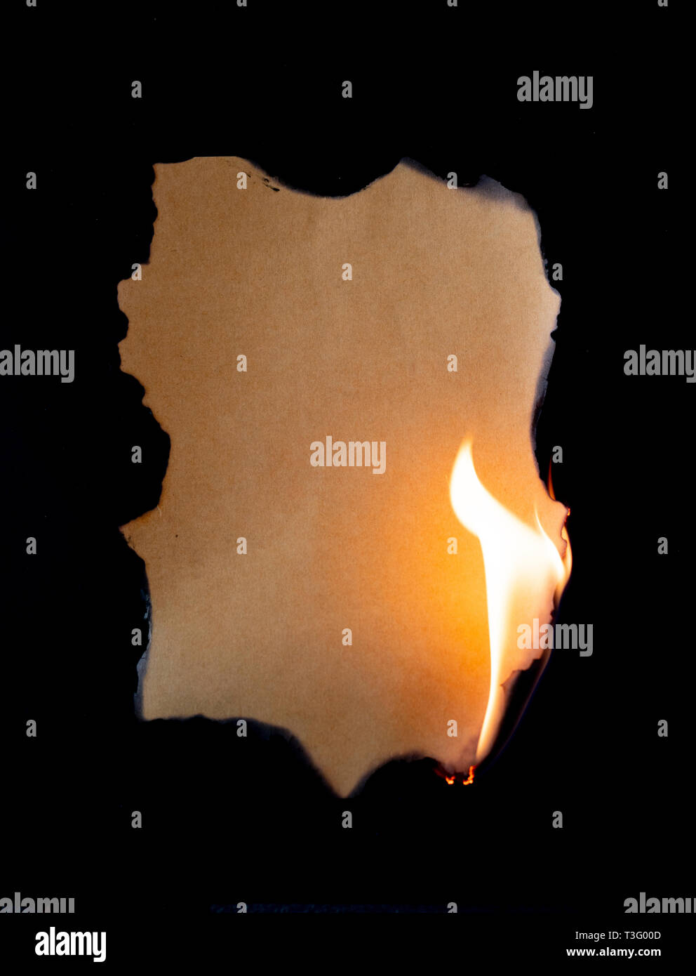 burning piece of paper on black background Stock Photo - Alamy