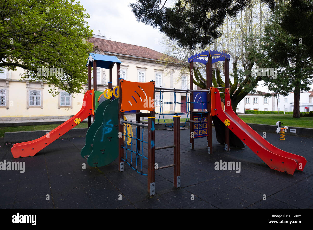 Empty kids' playground with slides Stock Photo - Alamy
