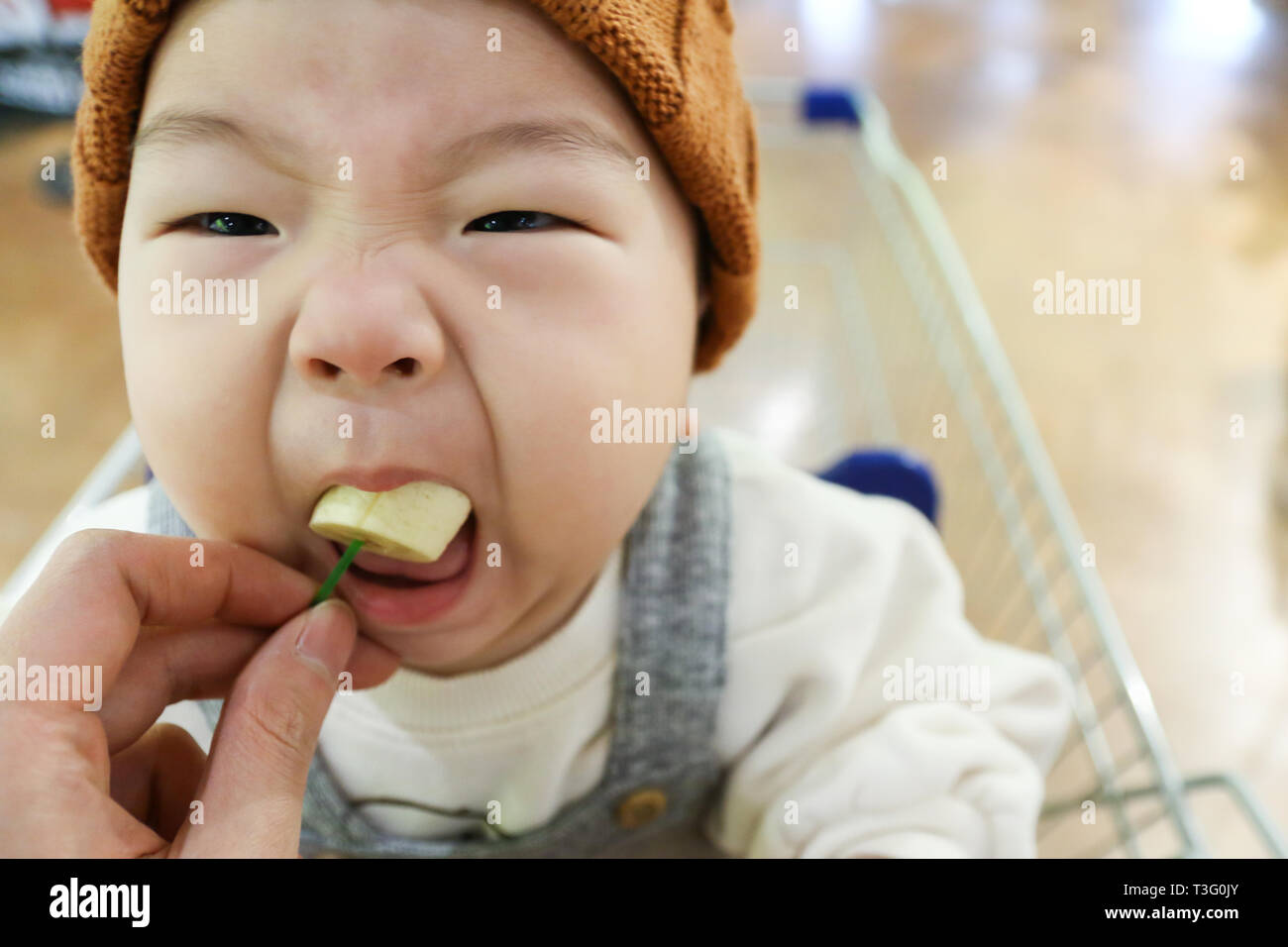Child tasting banana hi-res stock photography and images - Alamy