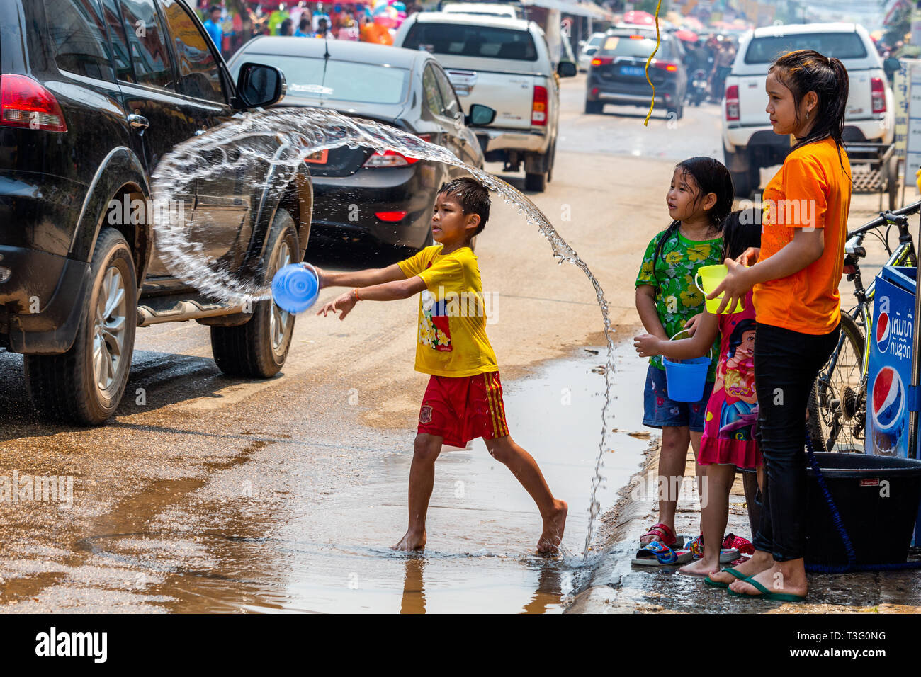 Vang Vieng, Laos - April 14, 2018: Kids throwing water on the streets ...
