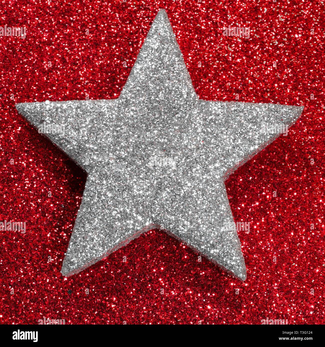 very big shape of silver star red background Stock Photo - Alamy