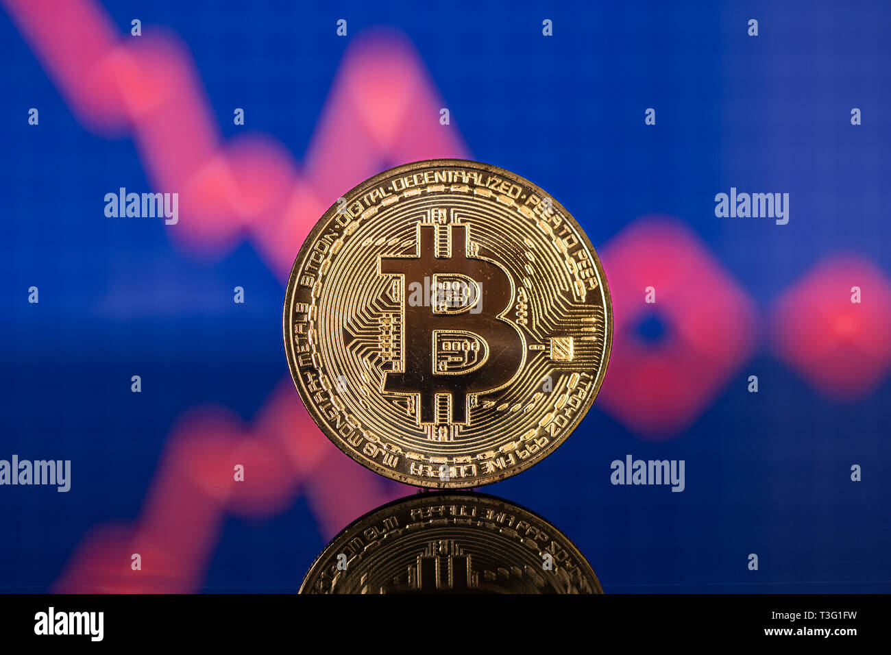 Bitcoin physical coin symbol with downtrend price graph background ...