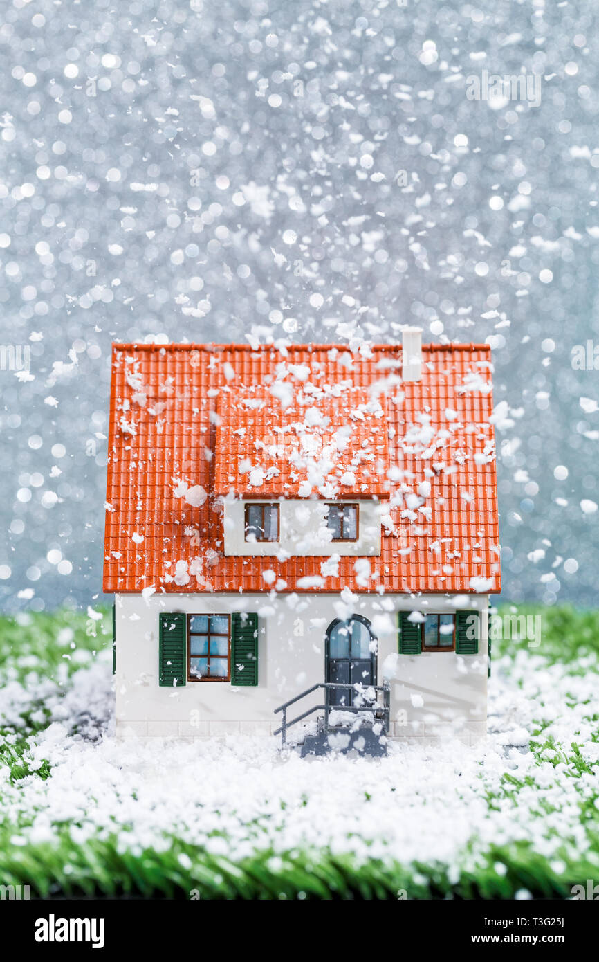 Picture of toy house with falling snow Stock Photo - Alamy