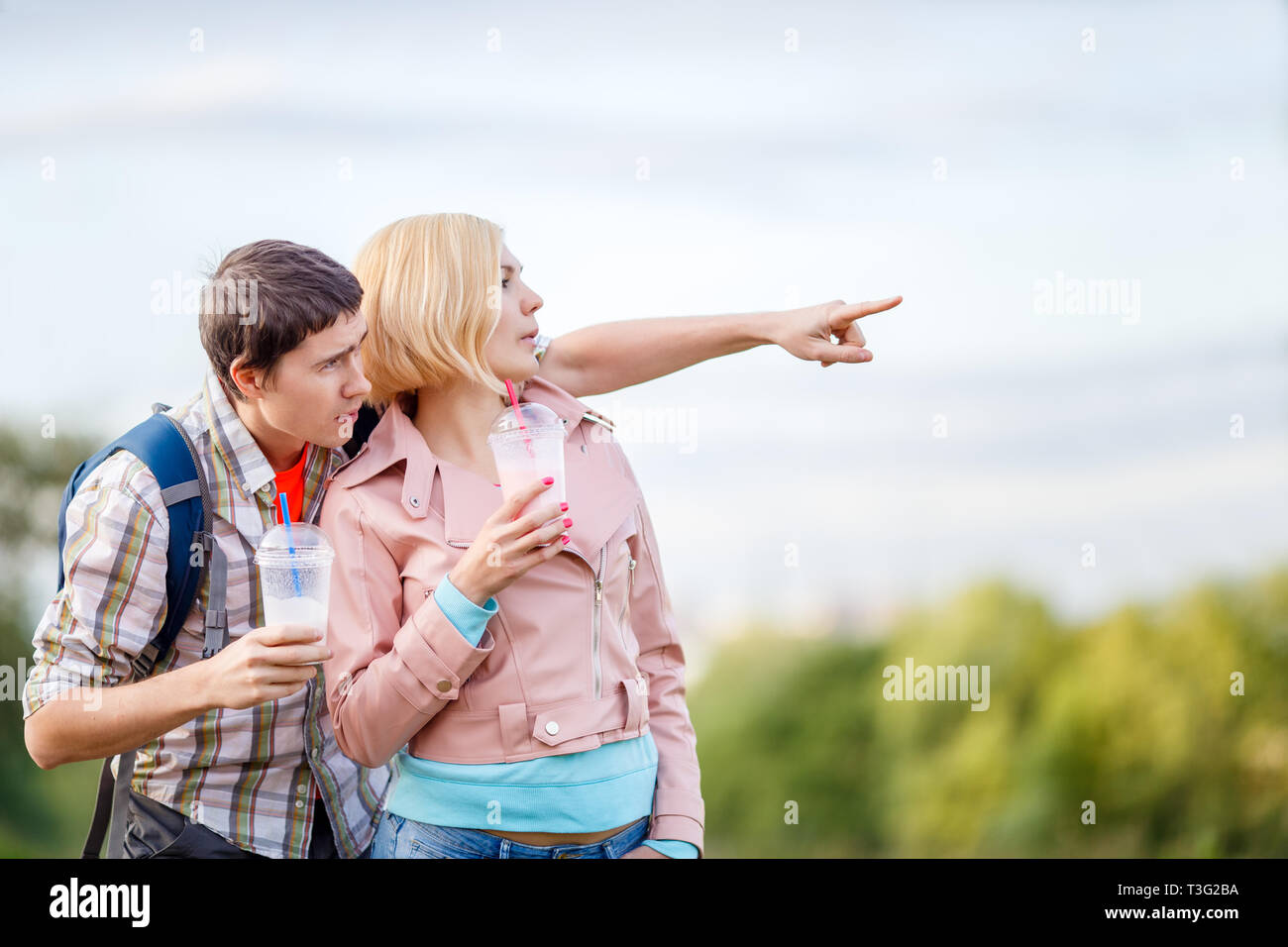 Guy showing hand to distance Stock Photo - Alamy
