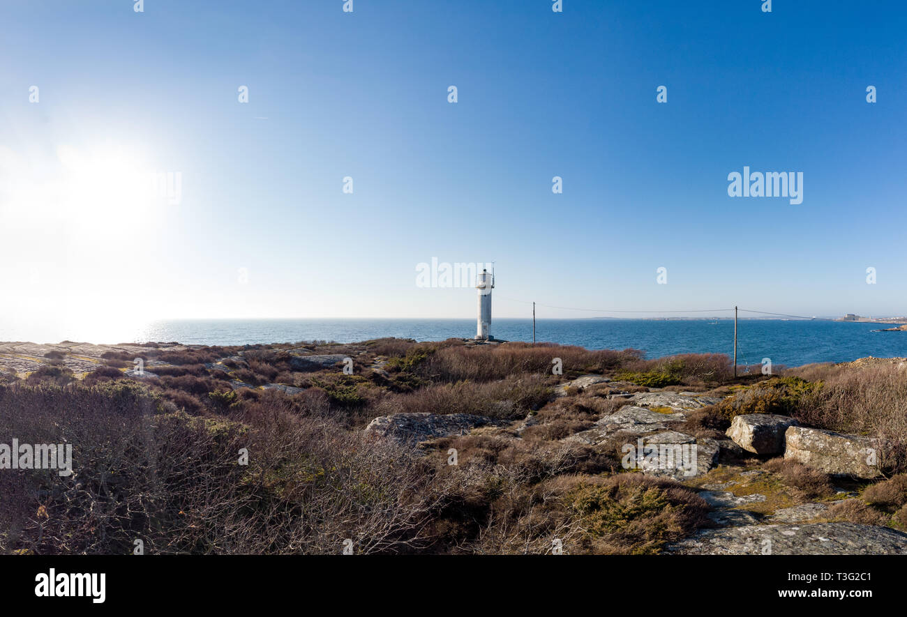 Lighthouse by the coast Stock Photo - Alamy