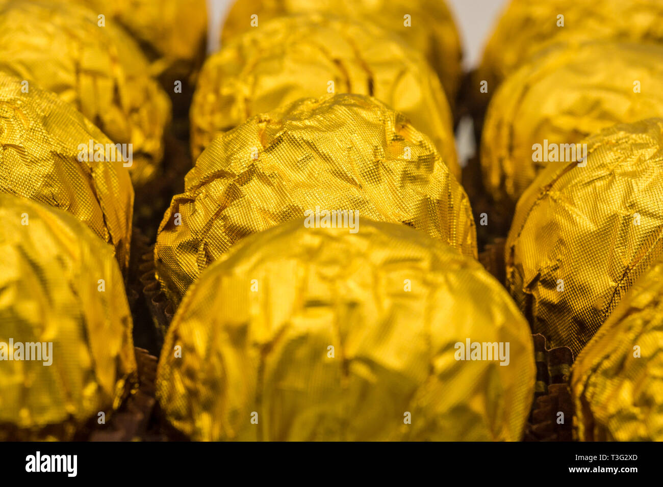 Foil wrapped chocolate Stock Photo - Alamy